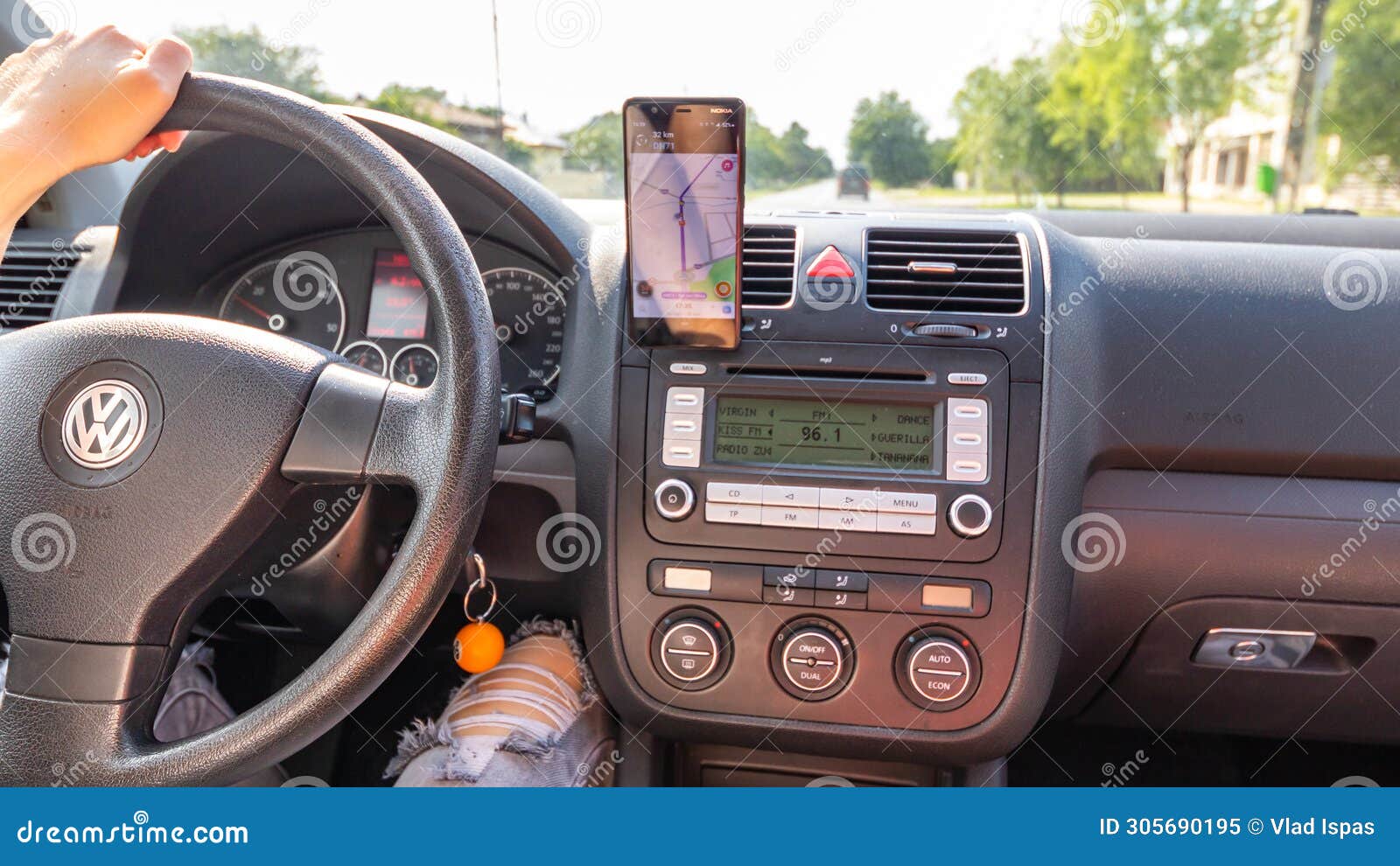 Waze Maps Showing The Way Thru The City. Driver Using Waze Maps ...