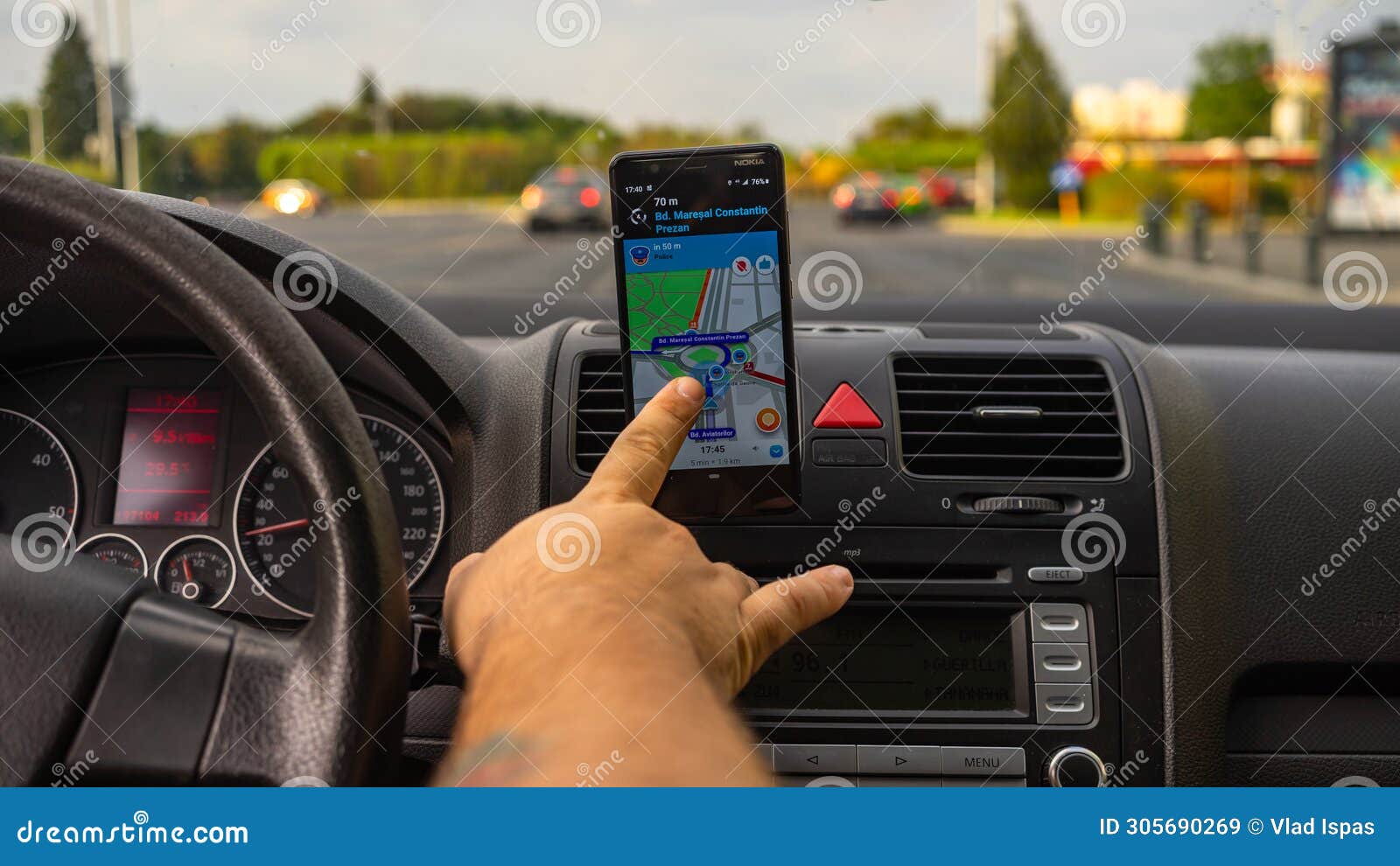 Waze Maps Showing the Way Thru the City. Driver Using Waze Maps ...