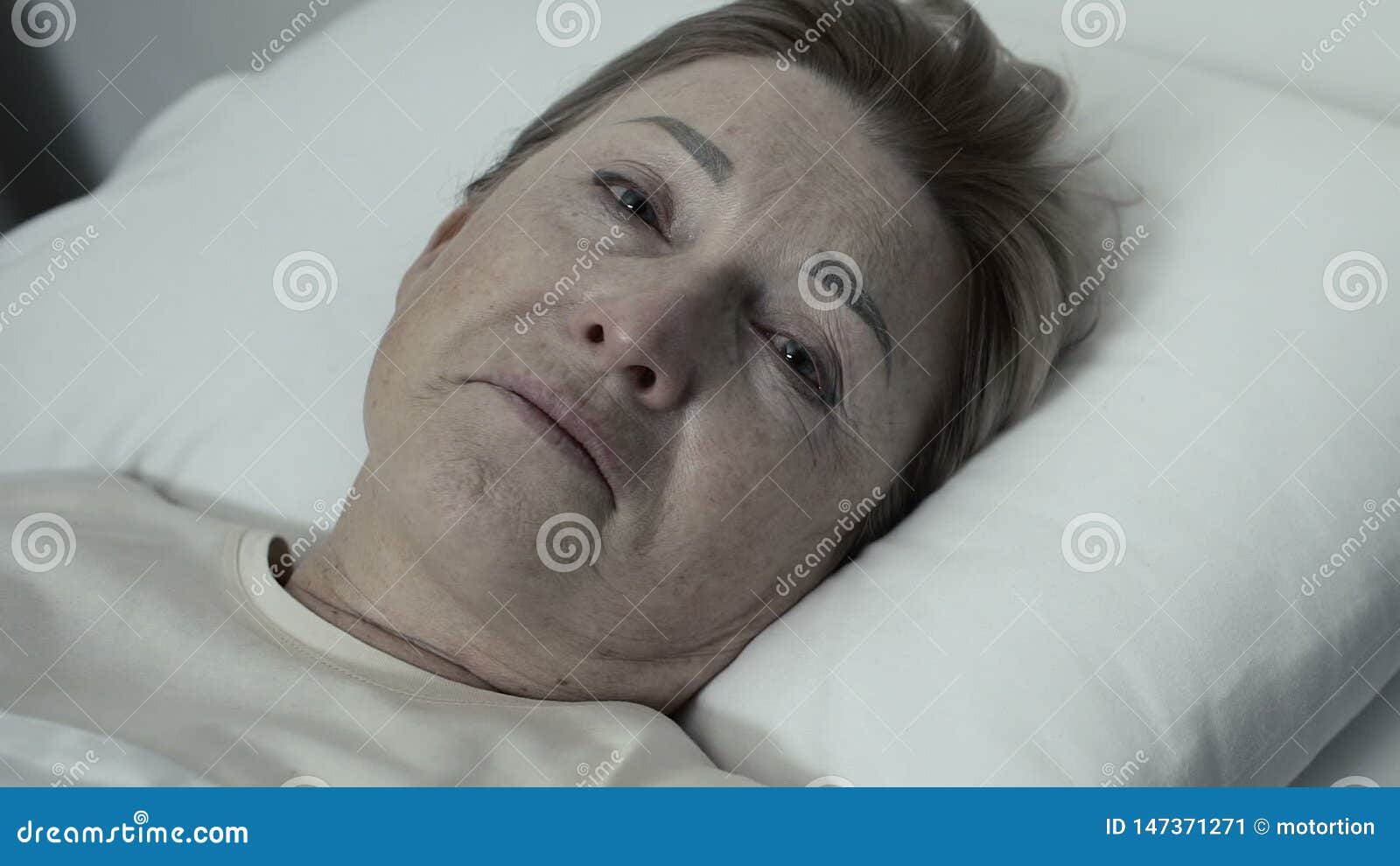 Weak Crying Lady Lying in Bed and Looking at Camera, Hospice Center ...