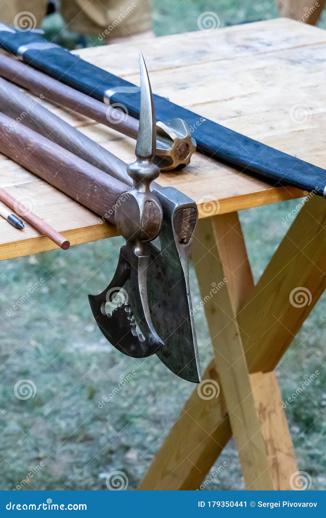 Weapon Of A Medieval Warrior, Battle Ax With A Sharp Thorn, A Heavy ...