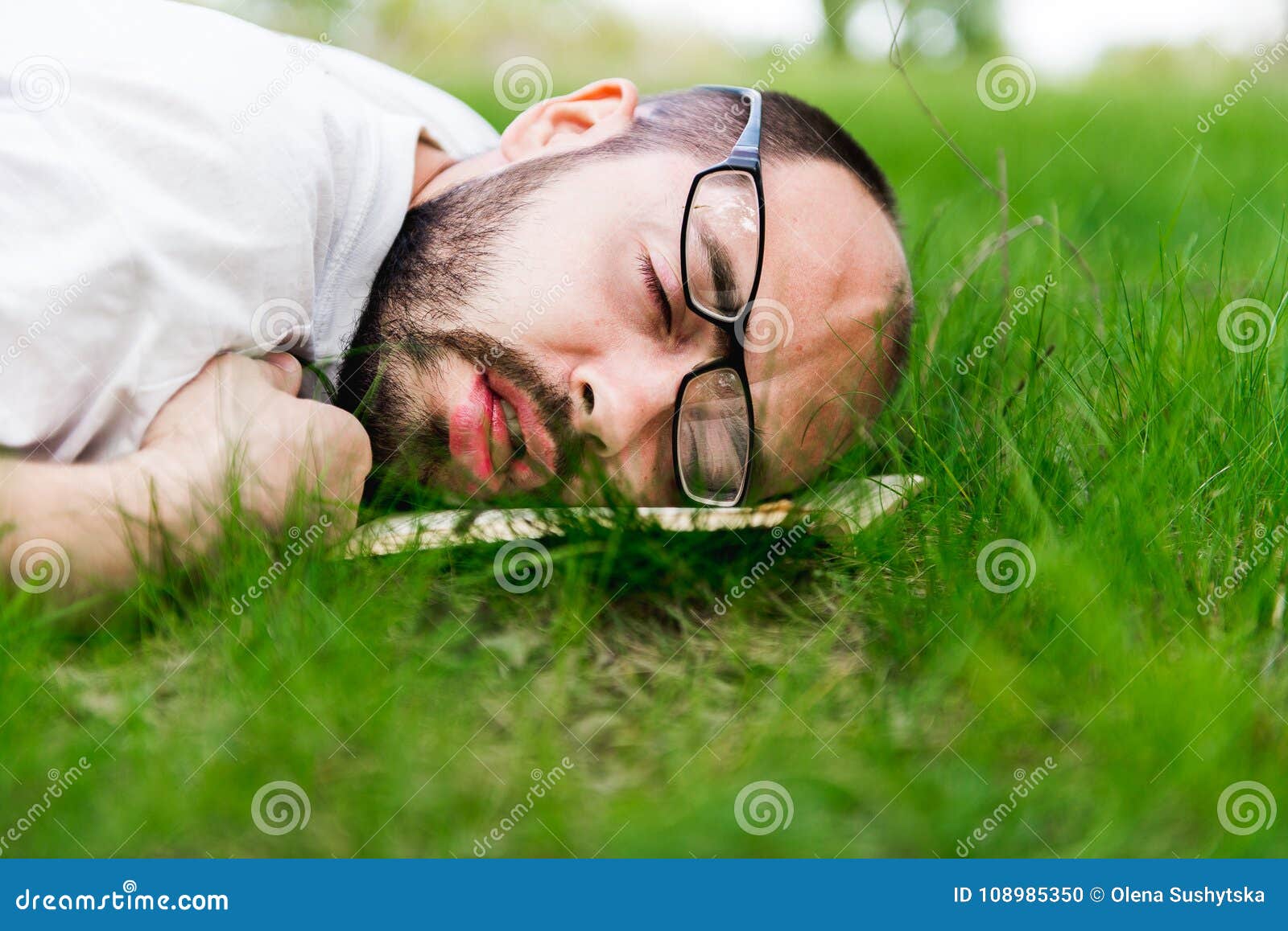 Weary Man Relaxing Outdoors Lying on the Grass Stock Photo - Image of ...