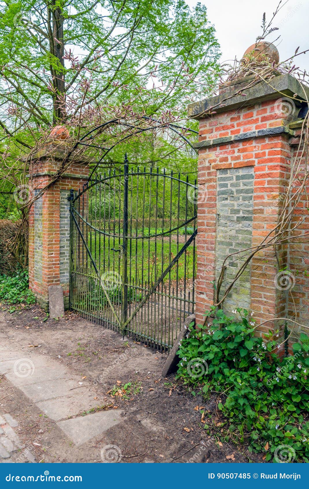Weathered Black Painted Iron Gate between Brick Pillars Stock Image ...