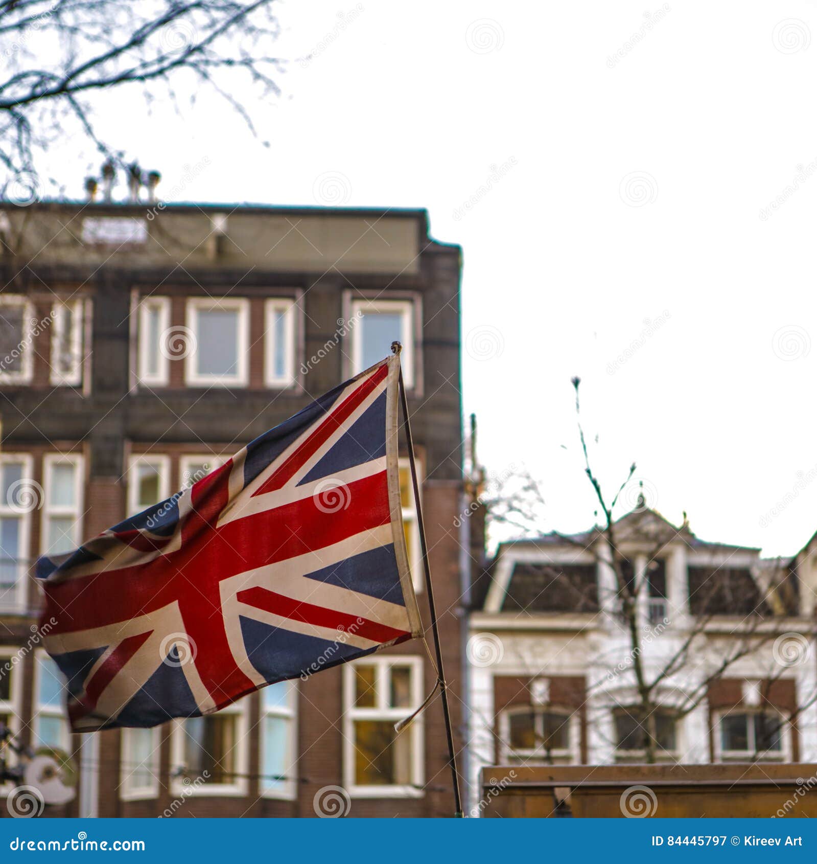 Weathered British Flag Against Traditional Buildings. Stock Image ...