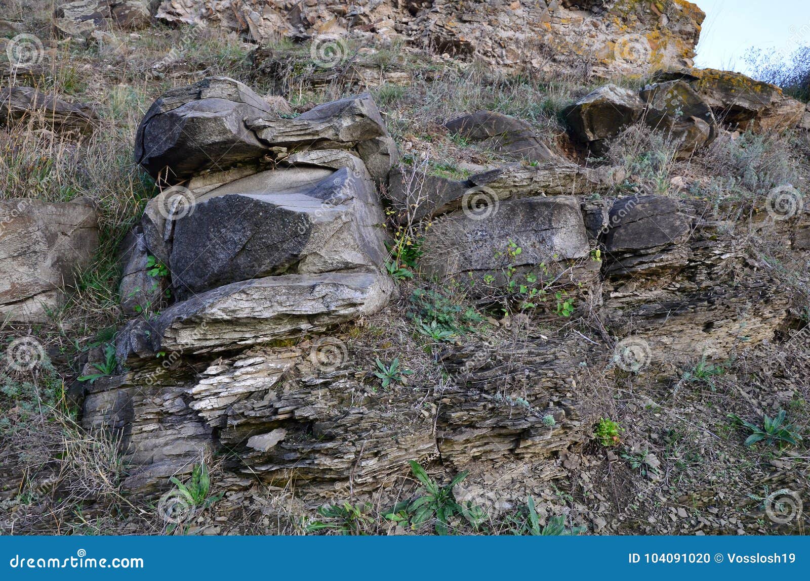 Weathered crumbling rocks. stock photo. Image of rocks - 104091020