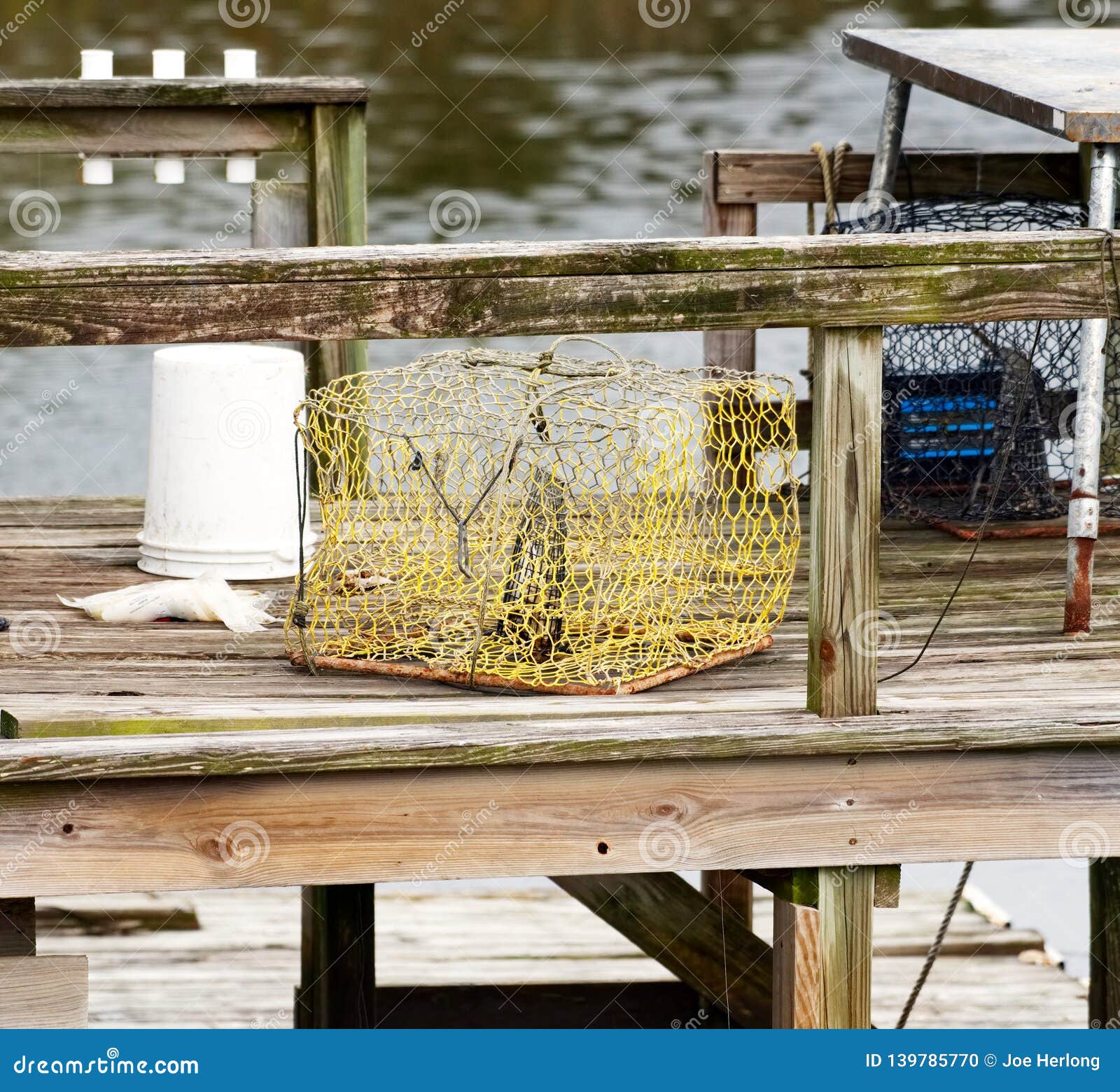 A Crab Pot on a Dock in a Salt-marsh Ready for Use.. Stock Photo ...