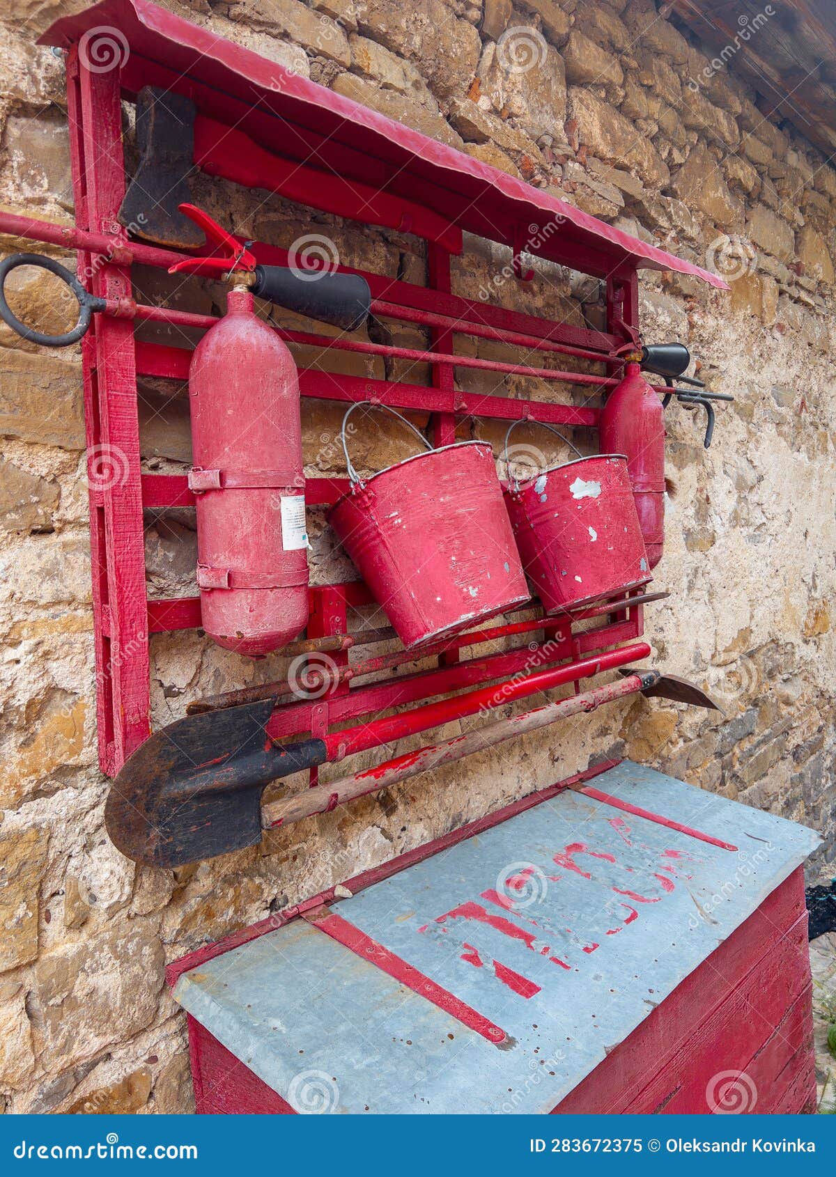 Weathered Fire-fighting Equipment on a Wall Outside Stock Image - Image ...