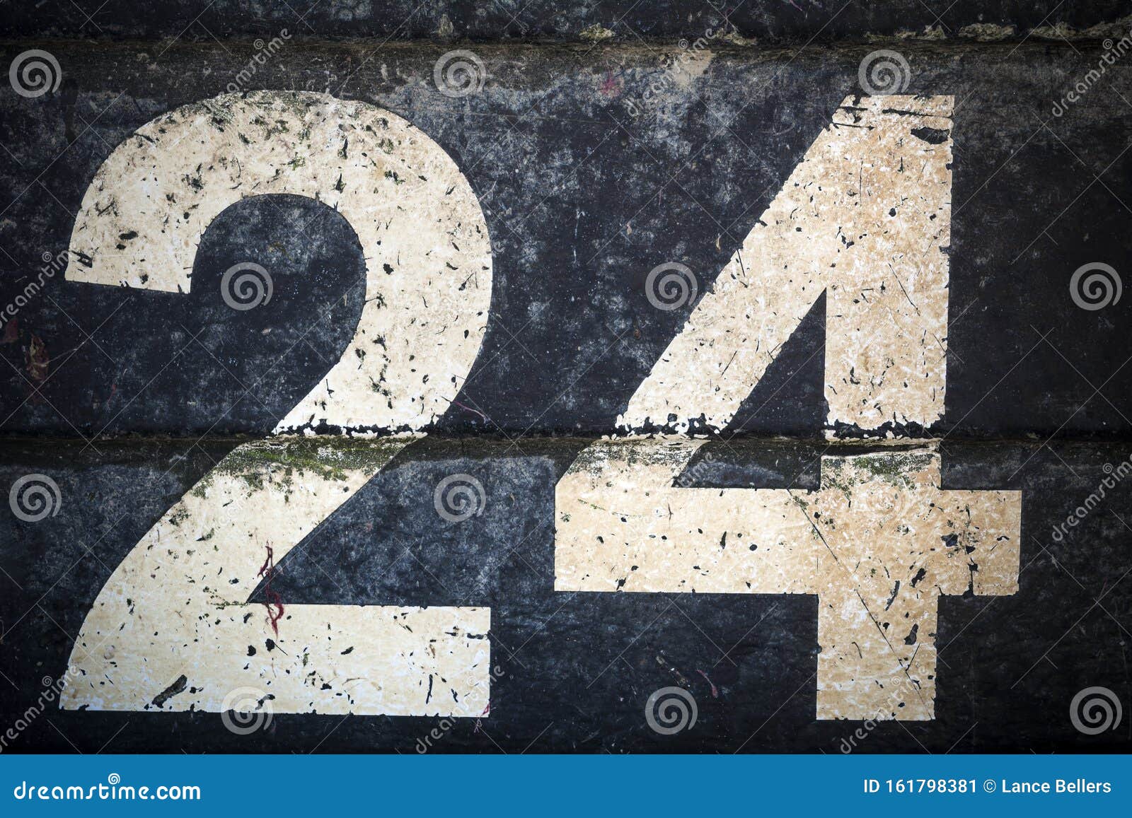 Weathered Number Twenty Four in Bold Figures on Black Background Stock ...