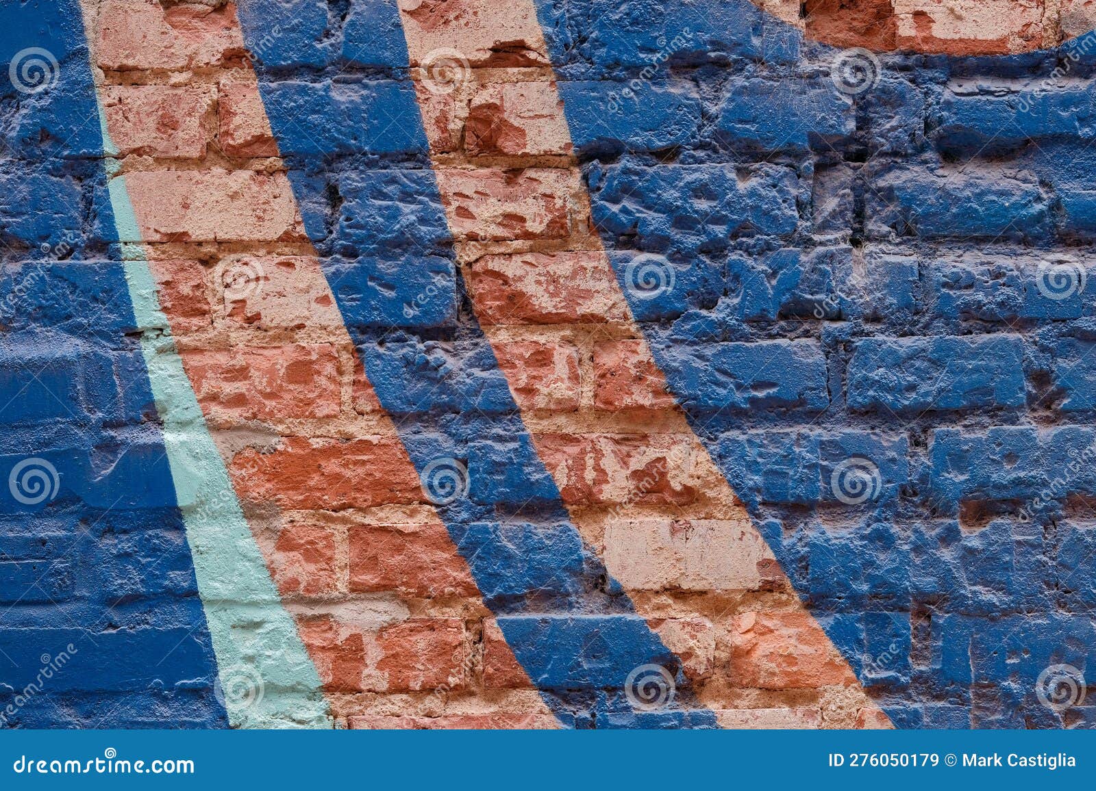 Weathered and Painted Brick Wall with Blue Background and Red Swoops ...