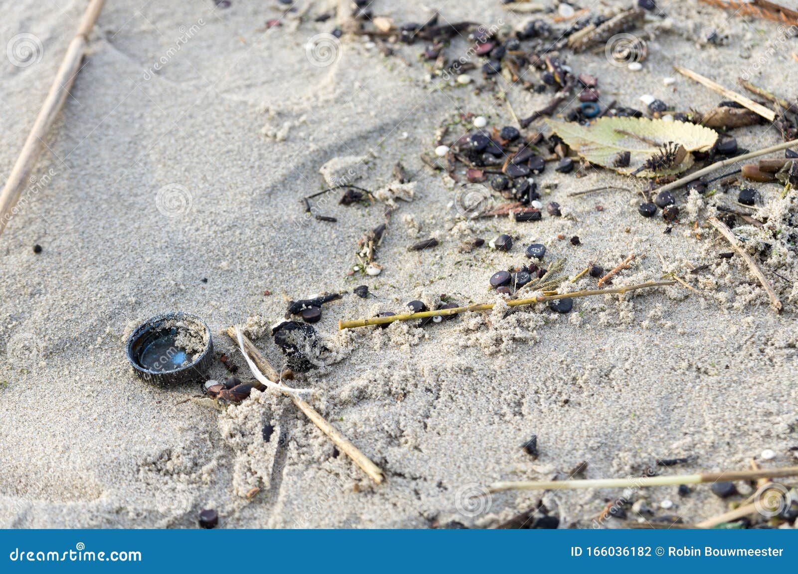 Weathered Plastic Bottle Cap between the Sand Stock Photo - Image of ...