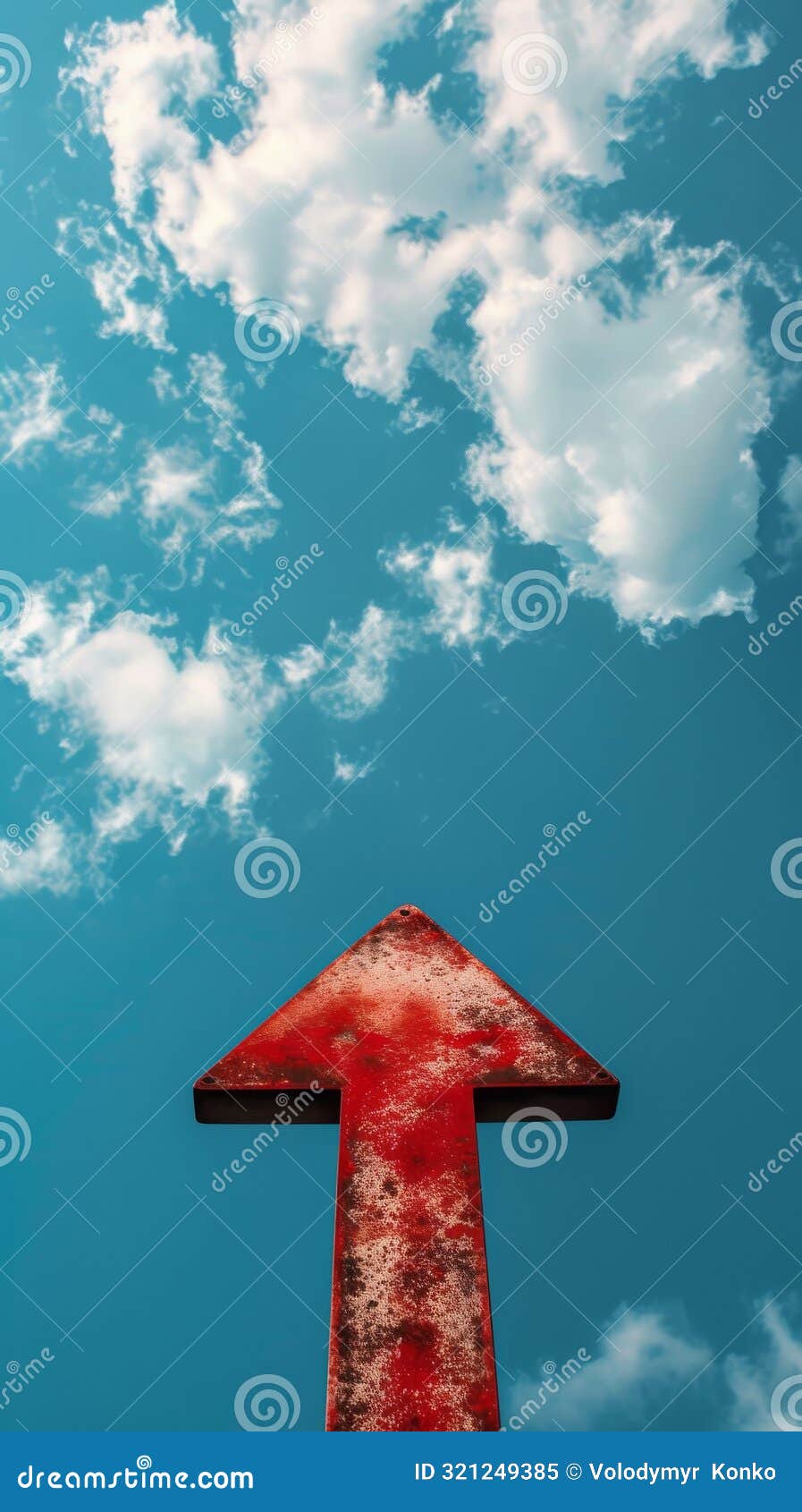 Weathered Red Arrow Pointing Upwards with a Cloudy Blue Sky Background ...