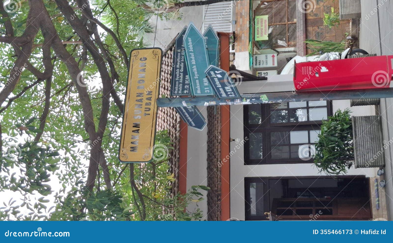A Weathered Signpost with Multiple Directional Signs Indicating Various ...