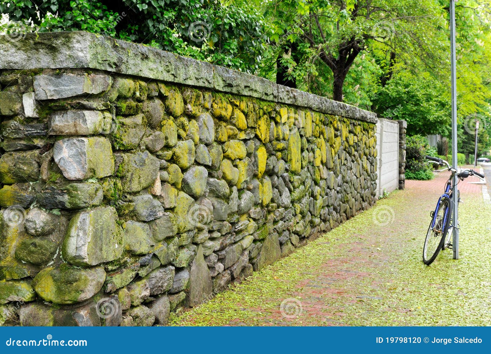 Weathered Stone Wall and Brick Sidewalk Stock Photo - Image of ...