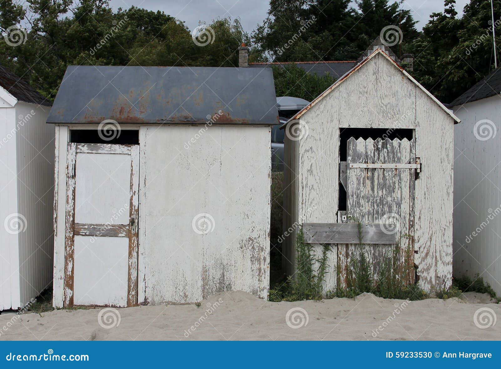 Weathered white beach huts stock photo. Image of coastal - 59233530