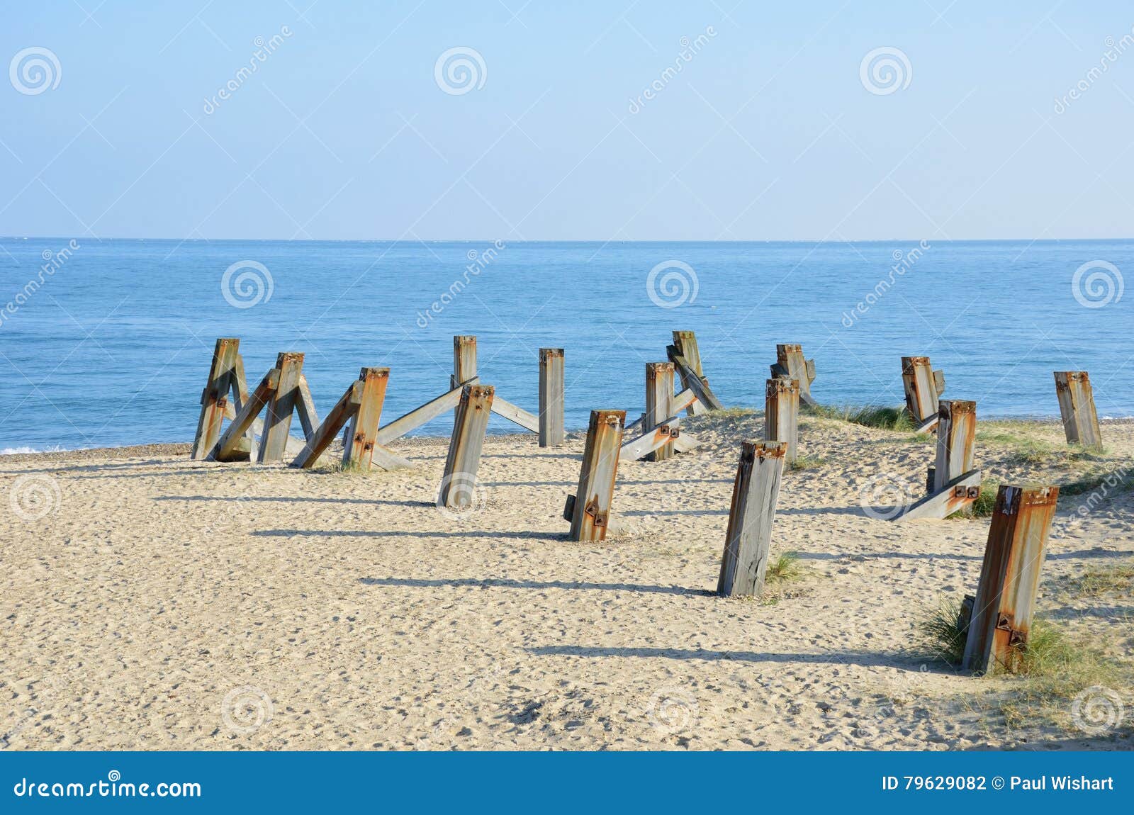 Weathered Wooden Posts in Ground Stock Photo - Image of sunny, groin ...