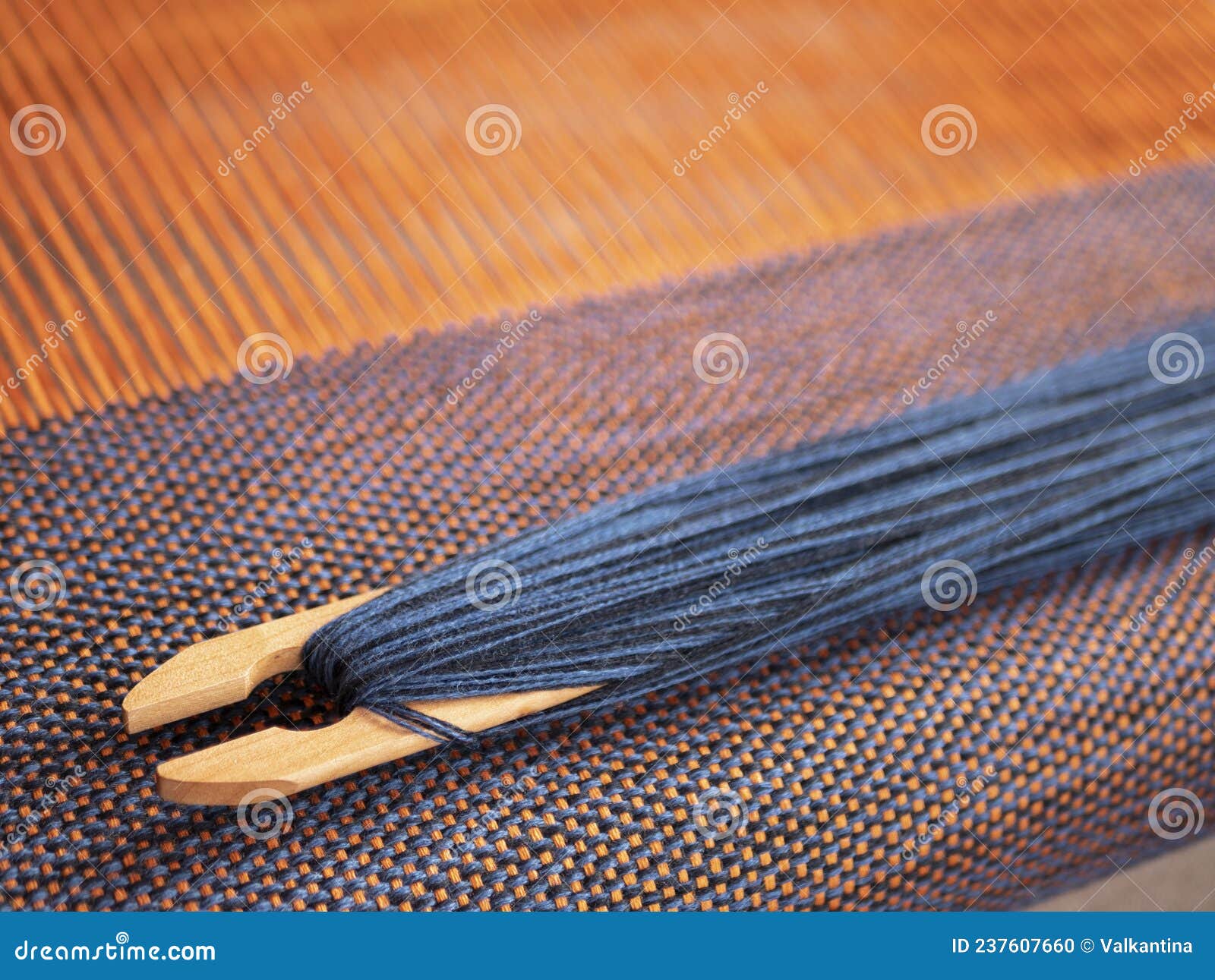 Weaving Shuttle with Blue Thread on the Orange Warp Stock Photo - Image ...