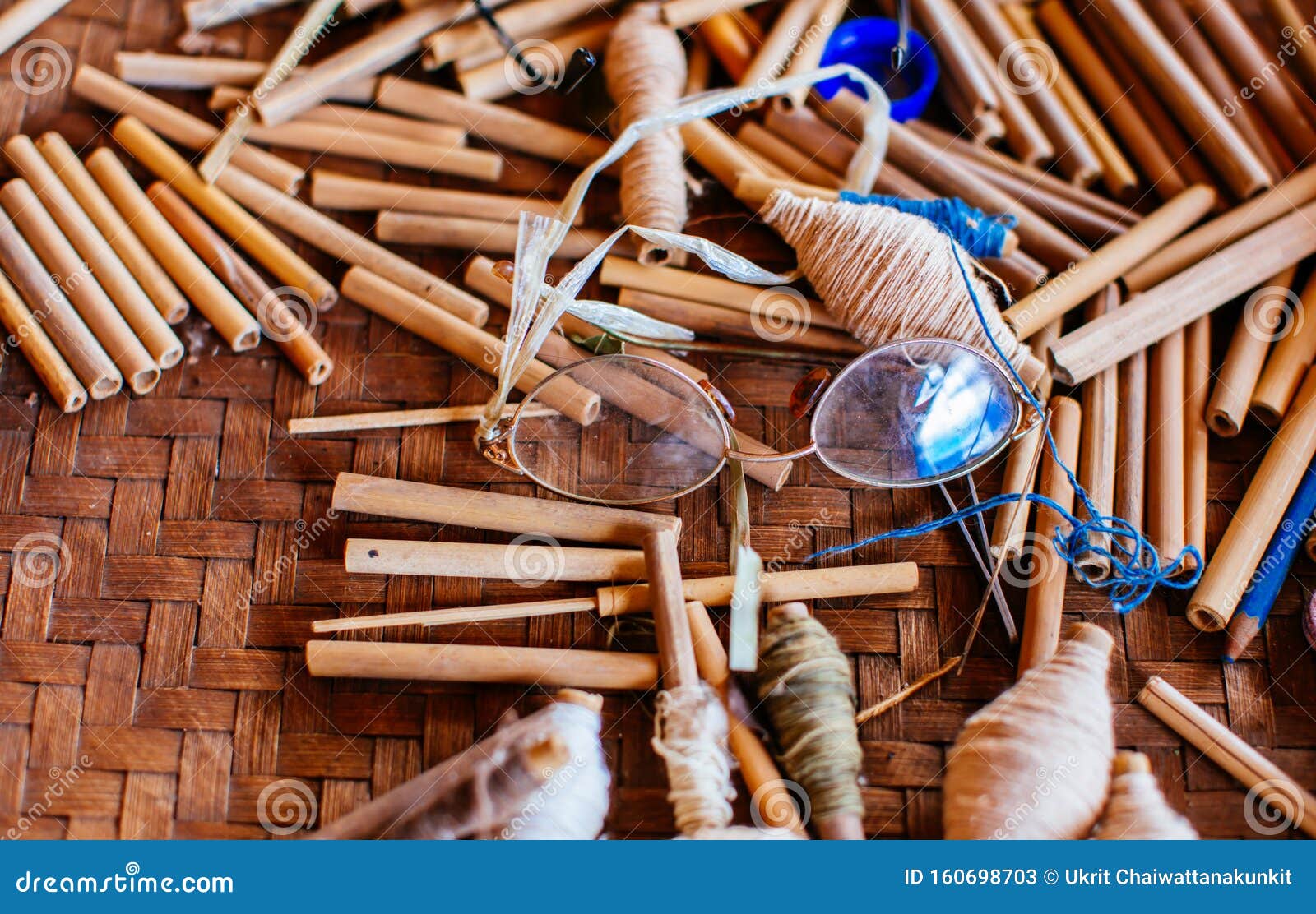 Weaving Tool on Woven Bamboo. Old Spool Made by Wooden. Cotton Spool on ...