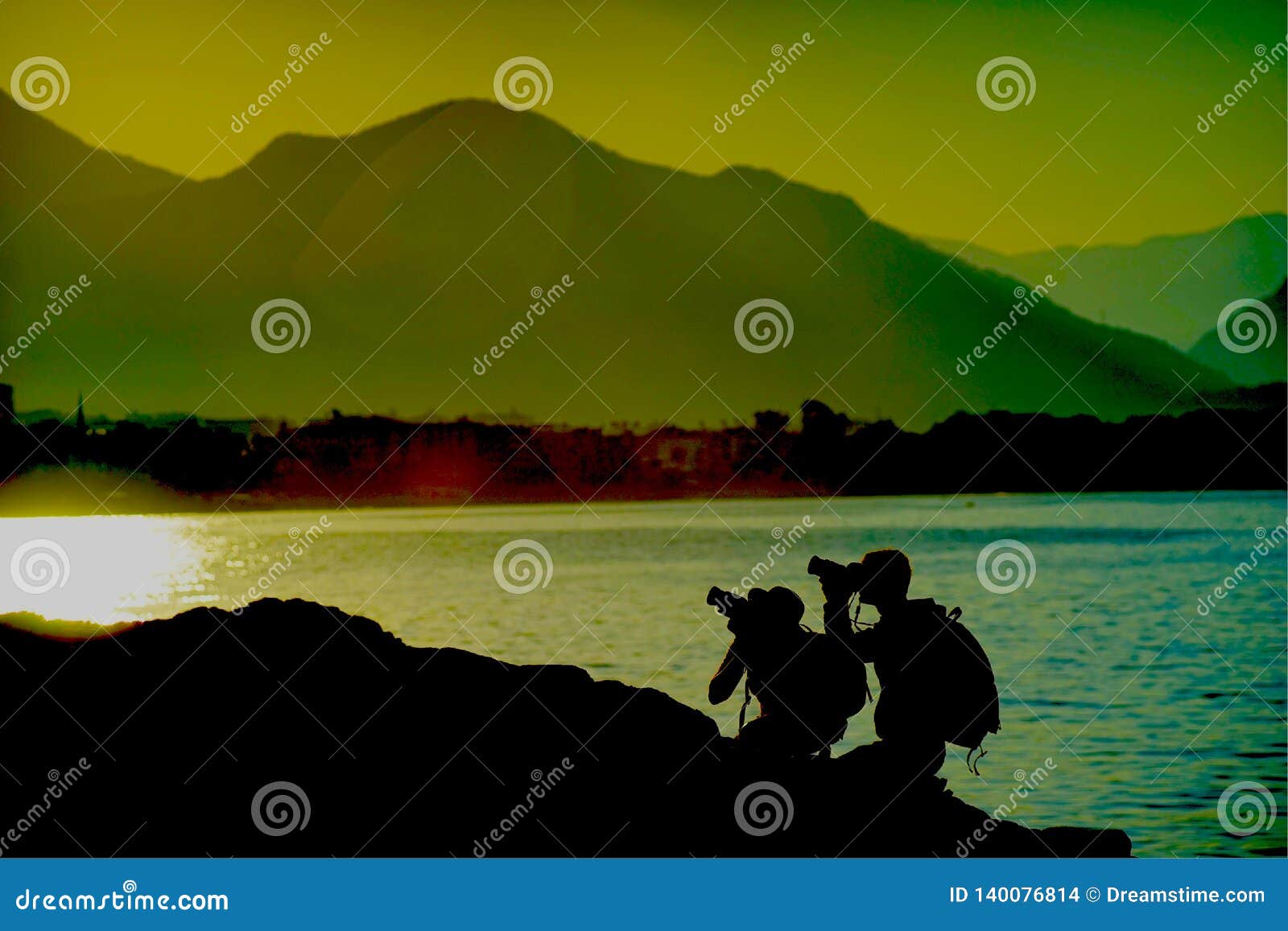 Two Photographers Hunting Good Shots Stock Photo - Image of blue ...
