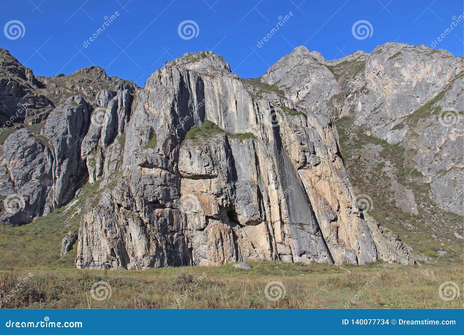 Green Landscape with Rocks, Mountains and Blue Sky Stock Photo - Image ...