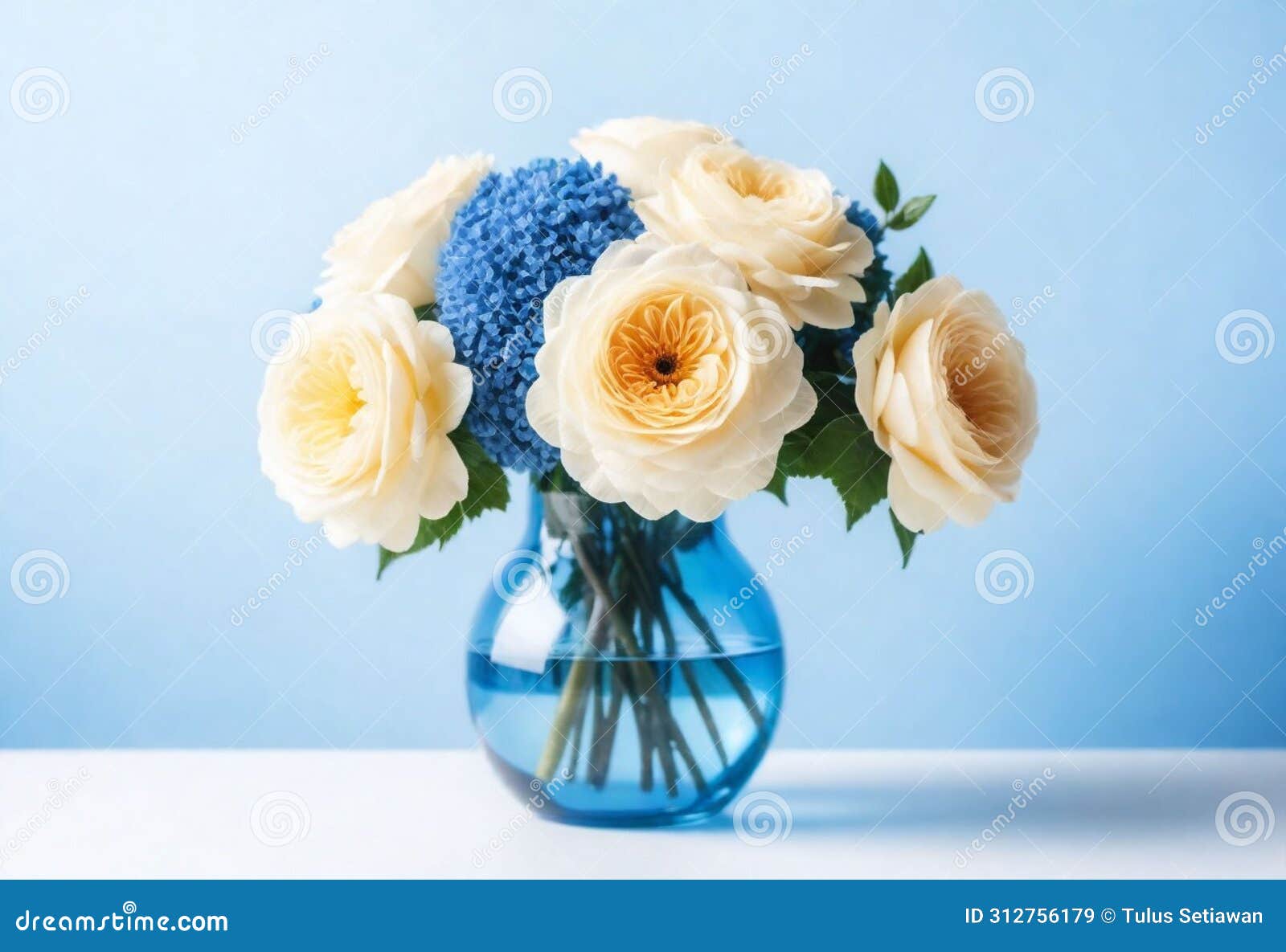 Beautiful Flowers of Cream and Blue Colors in a Glass Vase Stock Image ...