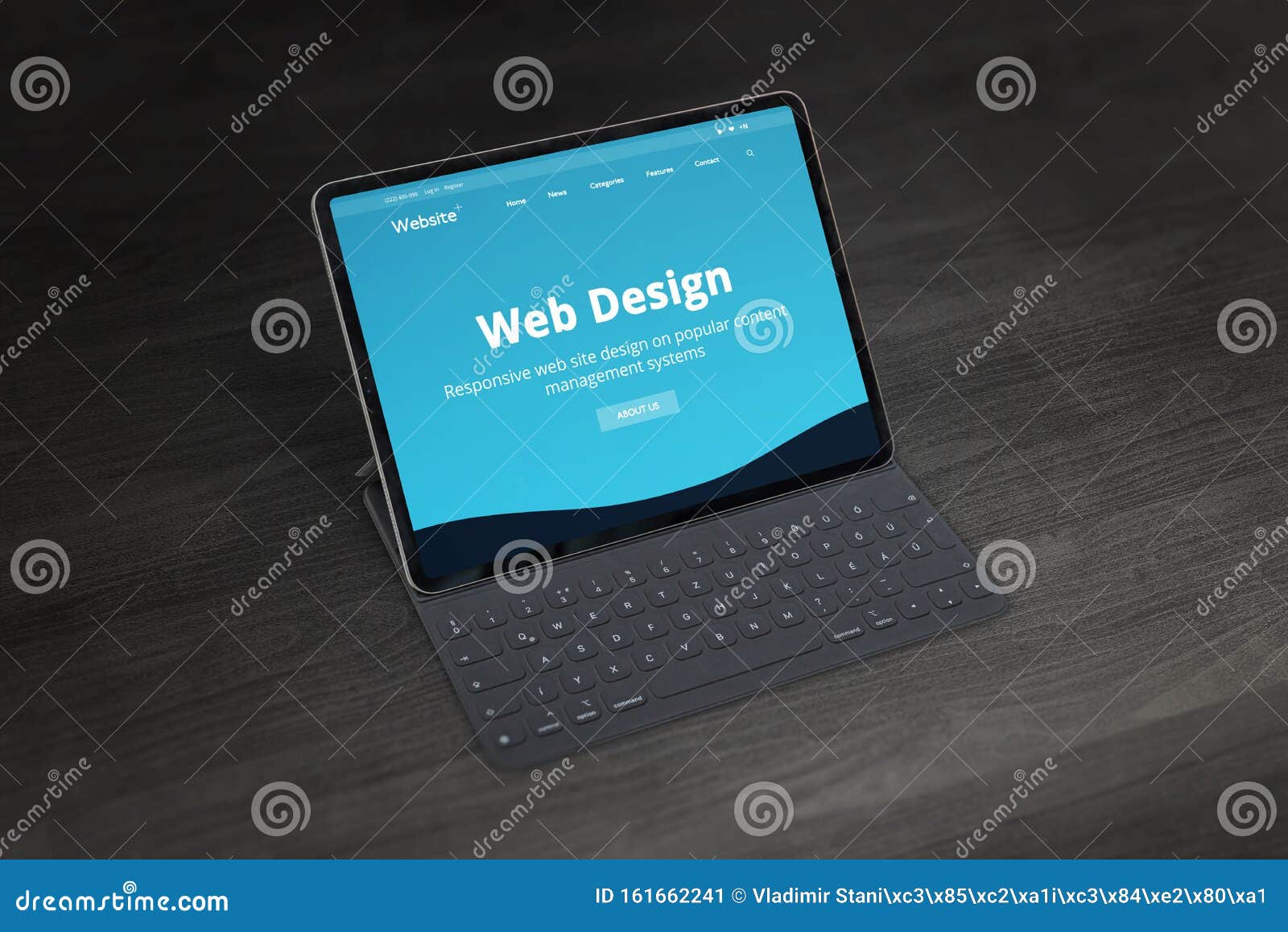 Web Design Studio Promo Web Site on Tablet with Keyboard on Office Desk ...