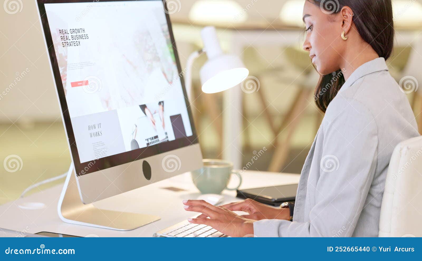 Web or Graphic Designer Typing on a Computer and Designing a Website in ...