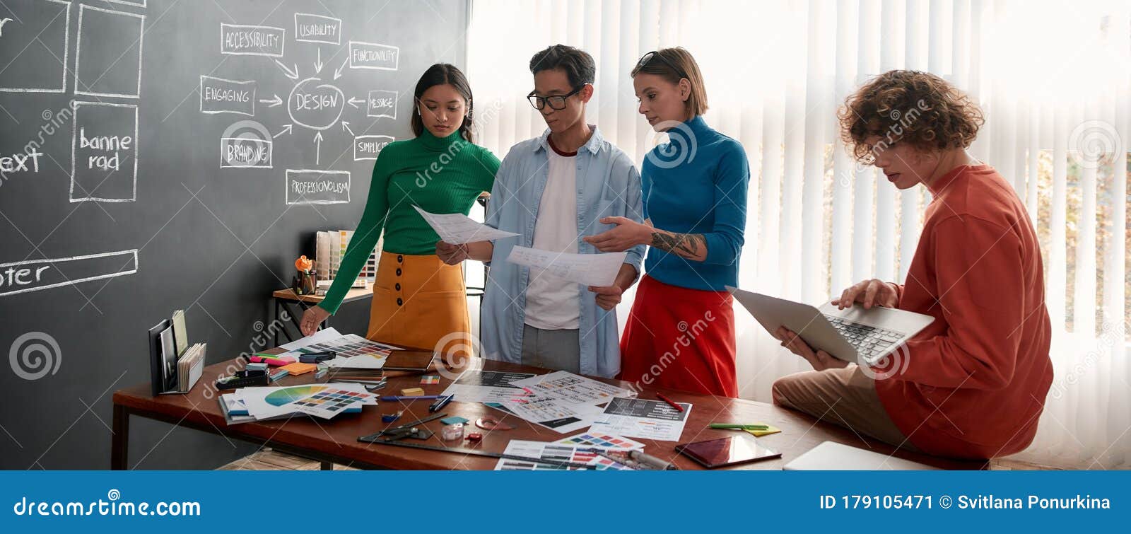 Web Site Development. Creative Group of Young Designers Discussing New ...