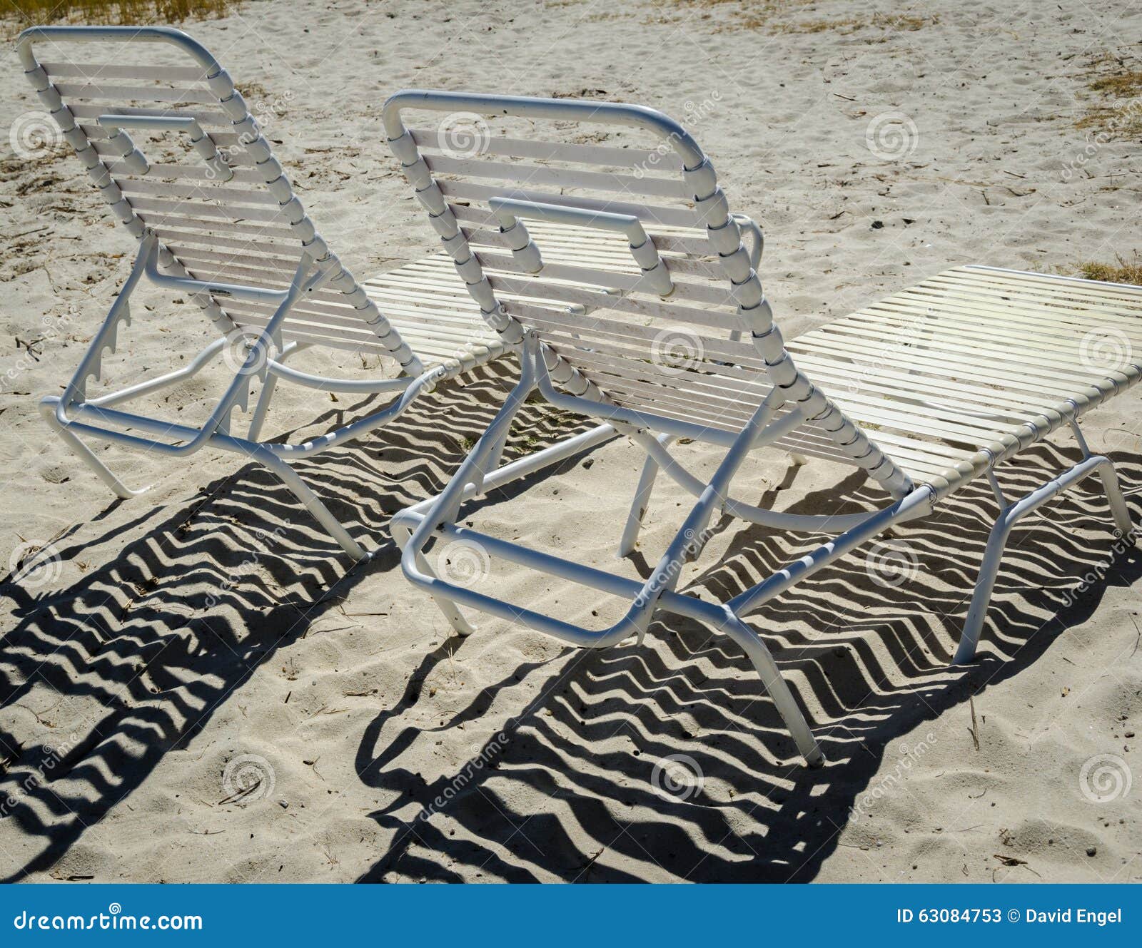 2 Webbed Beach Chaise Lounges with Shadow Pattern Stock Image - Image ...