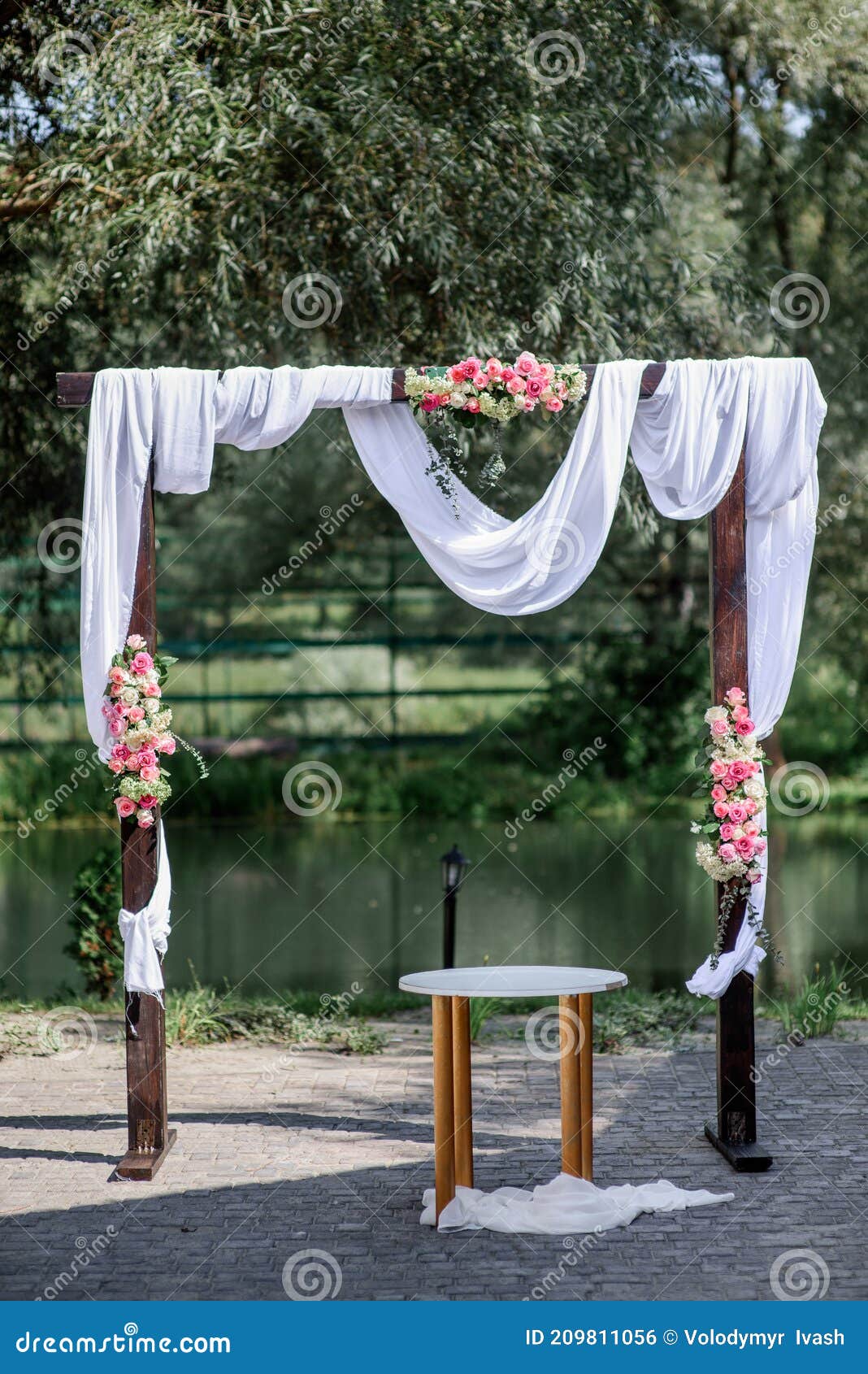 Wedding Altar Made of Wooden Frame and White Cloth with Flowers Stock ...
