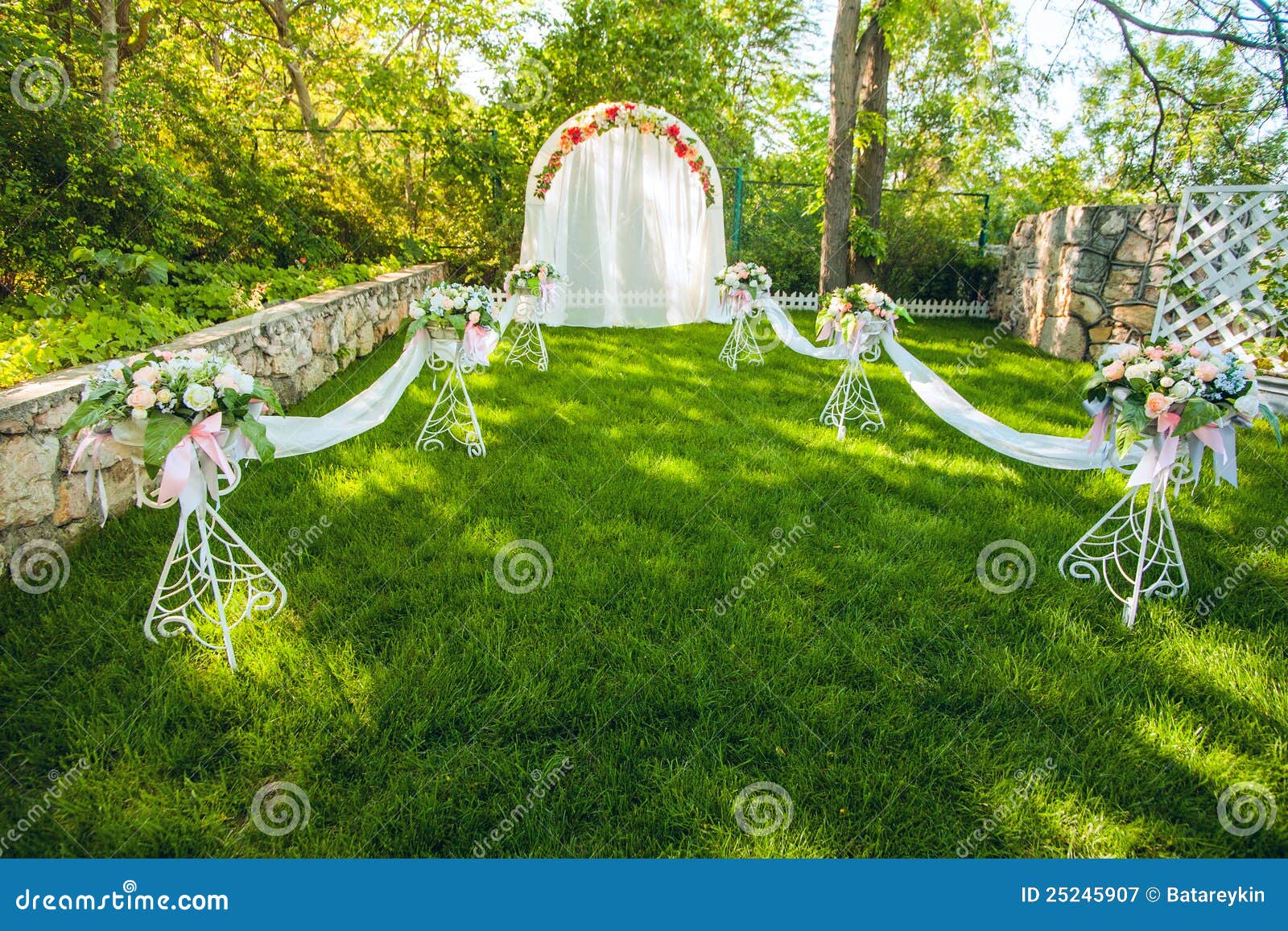 Wedding Arch on the grass stock image. Image of garland - 25245907