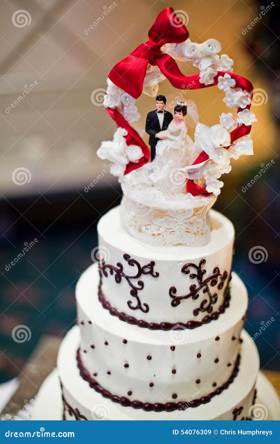 Wedding Cake with a Bride and Groom Topper Stock Image - Image of ...