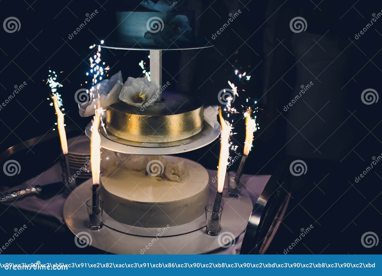 The Wedding Cake with Fireworks Stand on the Table in Restaurant. Stock ...