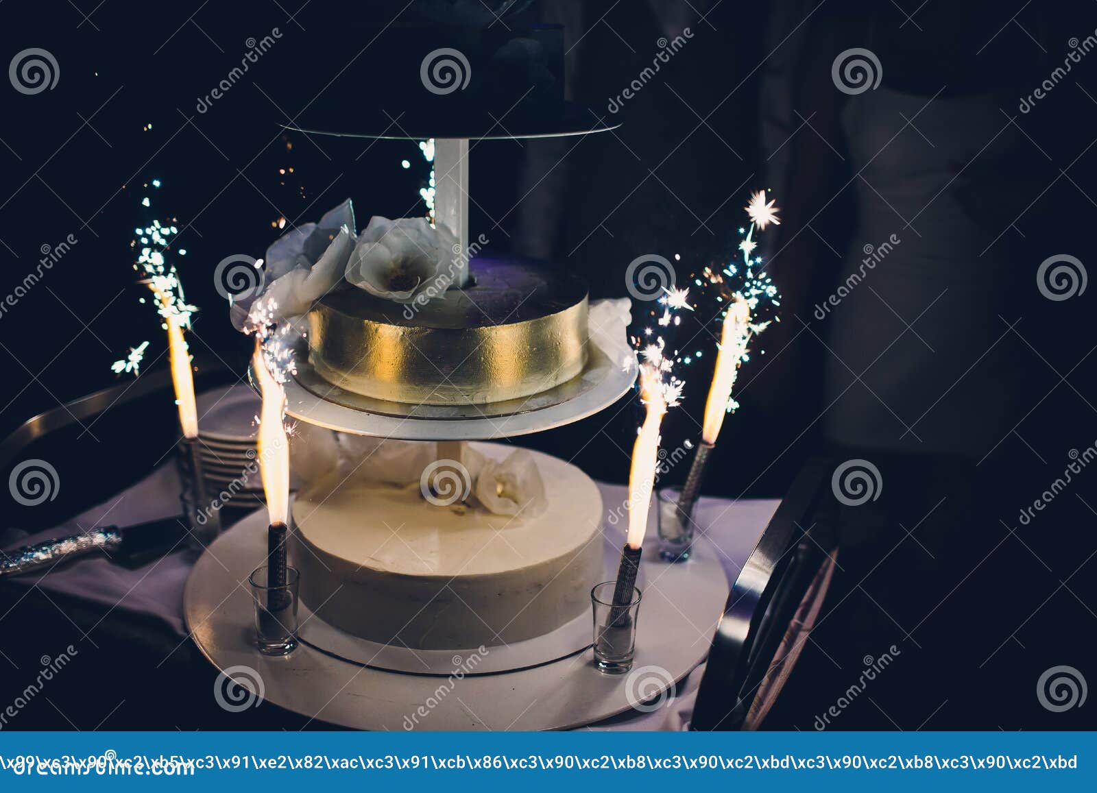 The Wedding Cake with Fireworks Stand on the Table in Restaurant. Stock ...