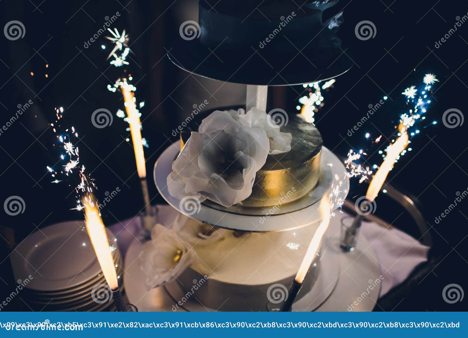 The Wedding Cake with Fireworks Stand on the Table in Restaurant. Stock ...