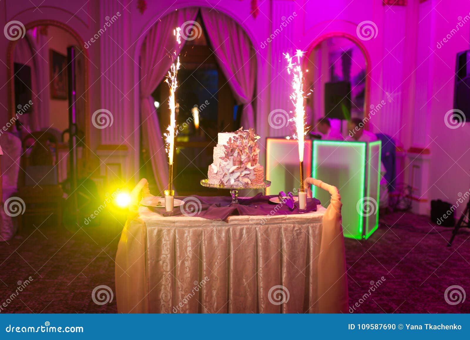 The Wedding Cake with Fireworks Stand on the Table in Restaurant Stock ...