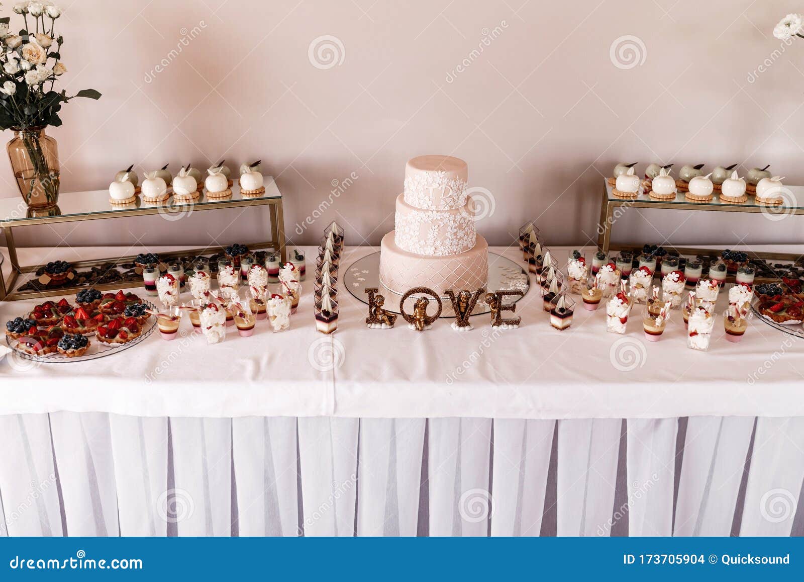 Wedding Cake and Mini Desserts on a Table Stock Photo - Image of event ...