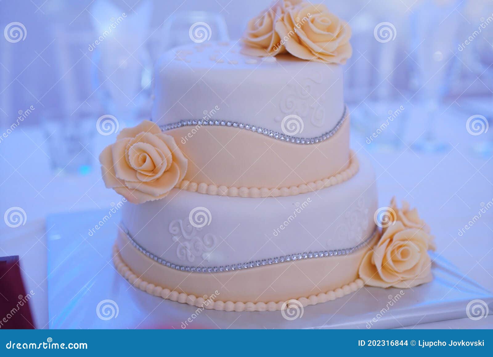 Wedding Cake with White and Orange Decorations Stock Photo - Image of ...