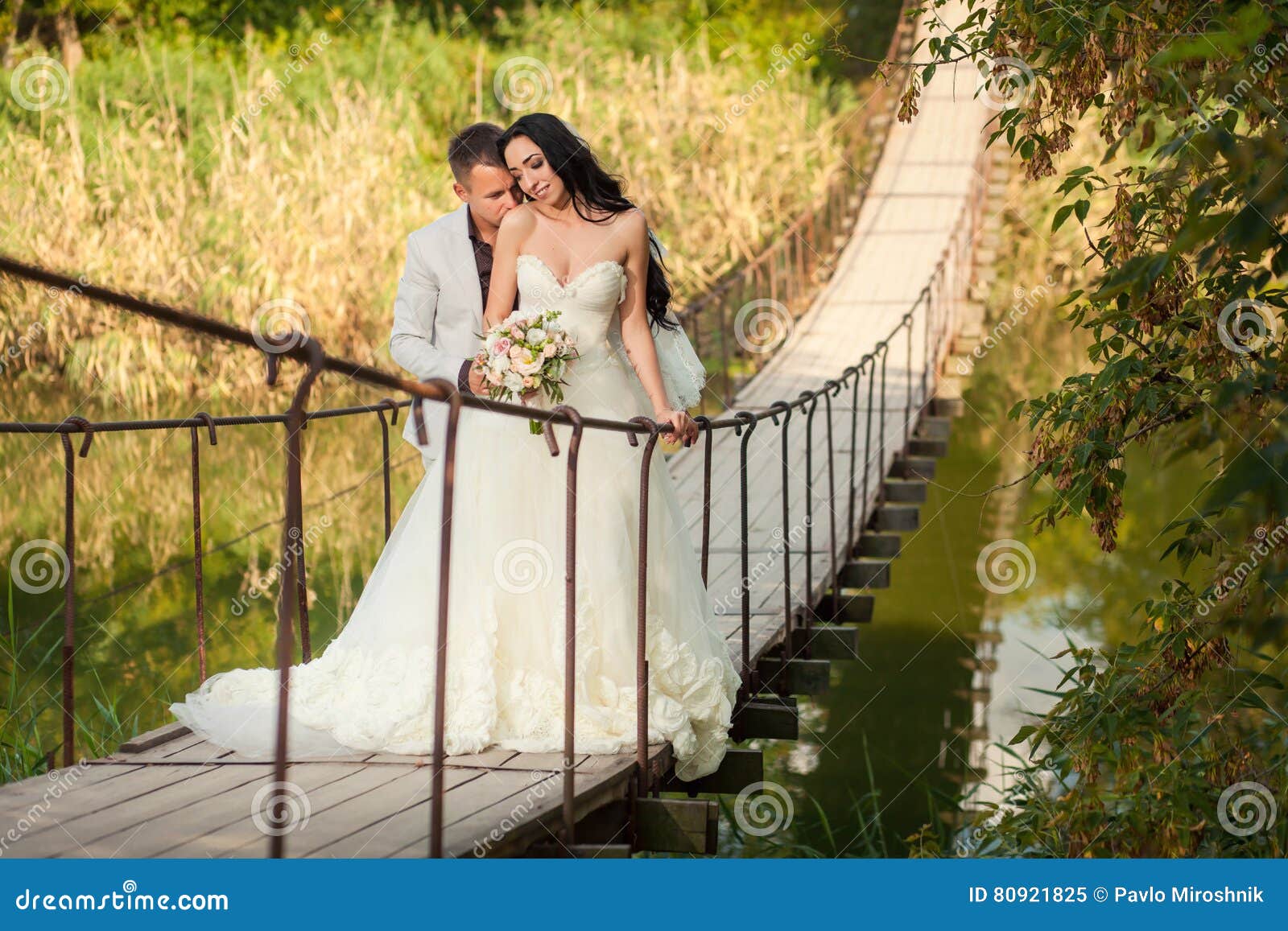 Wedding couple on bridge stock image. Image of wedding - 80921825