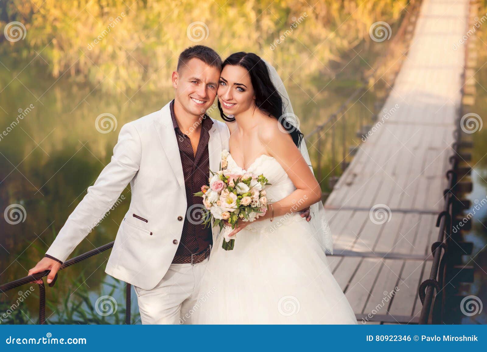 Wedding couple on bridge stock photo. Image of outdoor - 80922346