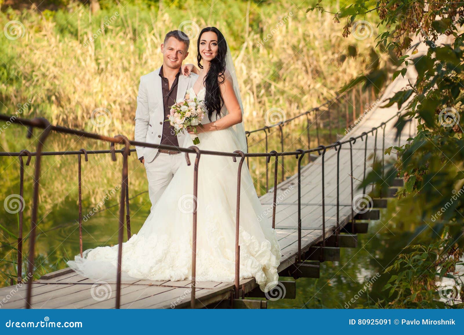 Wedding couple on bridge stock image. Image of wedding - 80925091