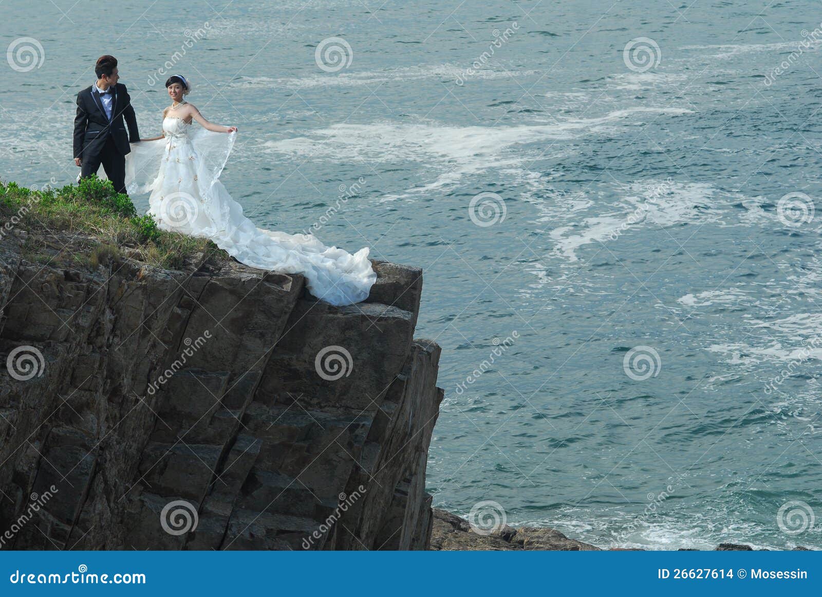 Wedding couple at cliff stock photo. Image of landscape - 26627614