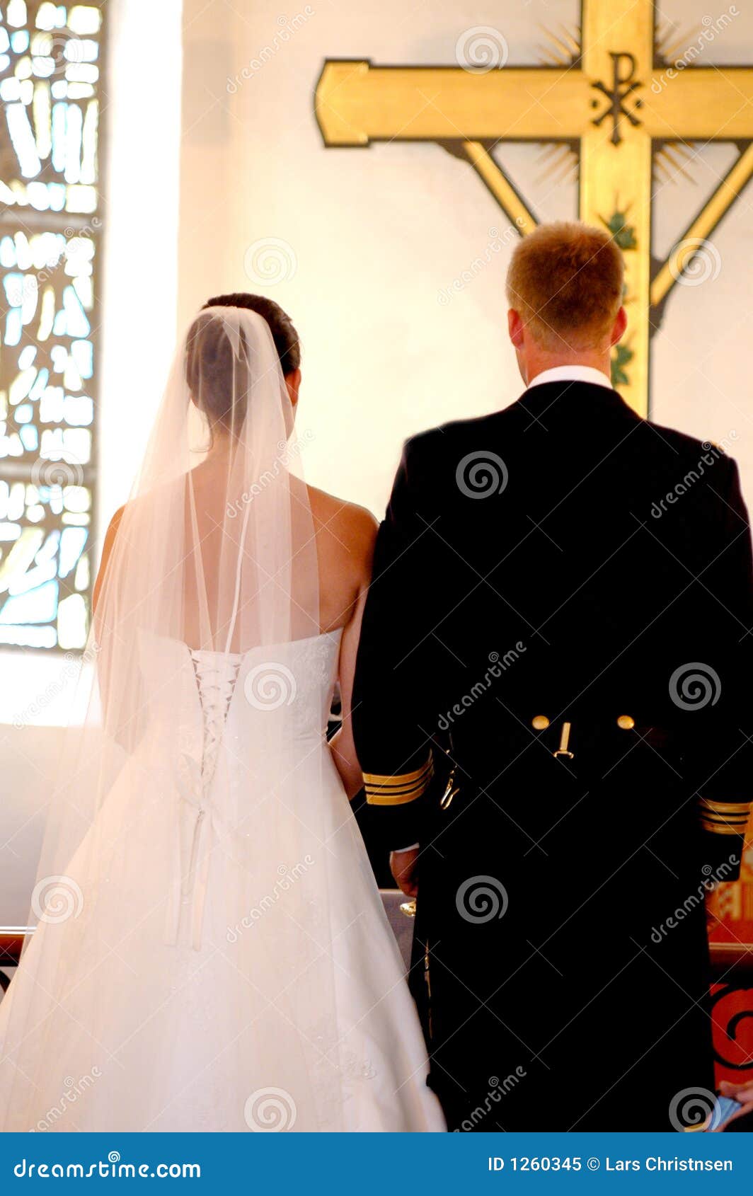 Wedding couple and cross stock image. Image of marrage - 1260345