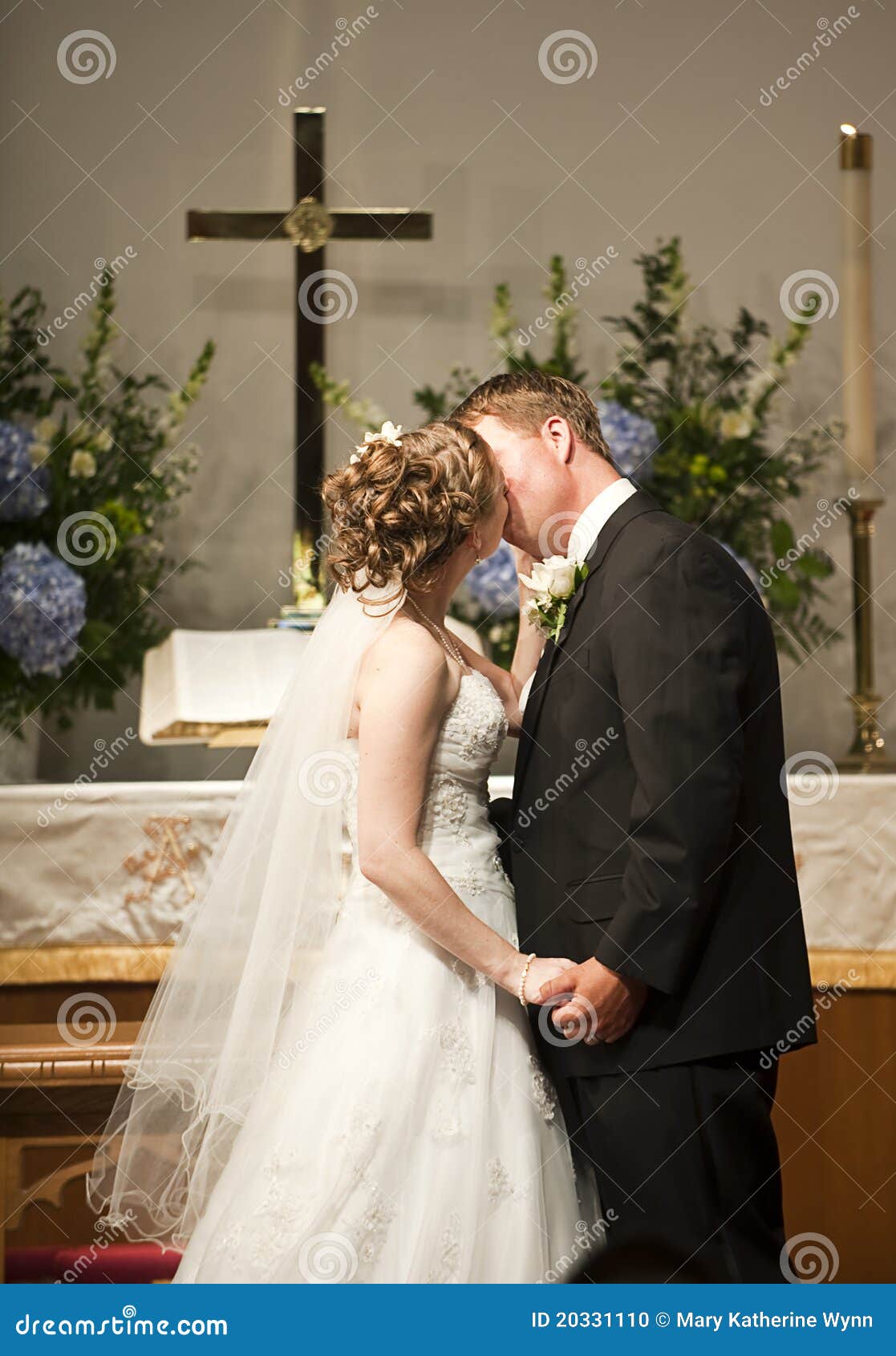 Wedding couple first kiss stock photo. Image of religious - 20331110