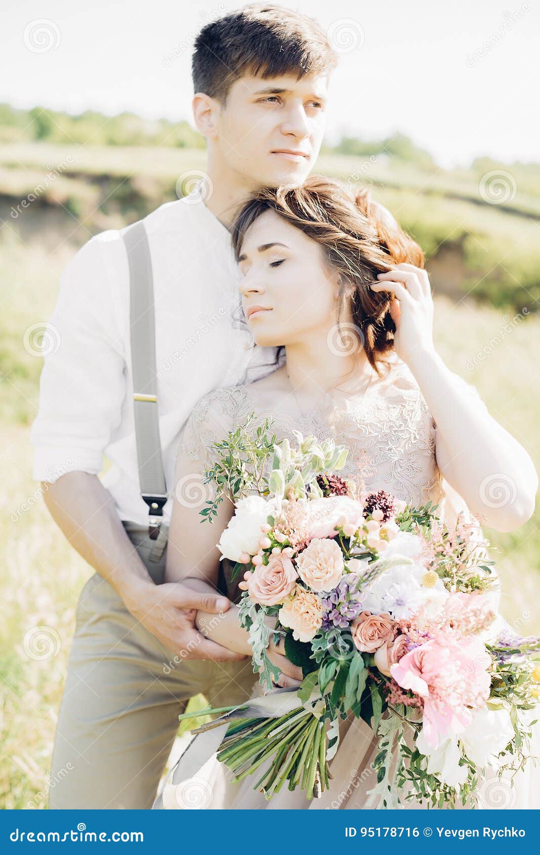Wedding Couple on Nature. Bride and Groom Hugging at Wedding. Stock ...
