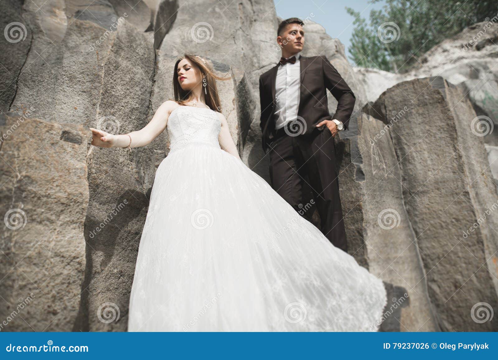 Wedding Couple Posing on Great Stones. the Bride and Groom Stock Photo ...