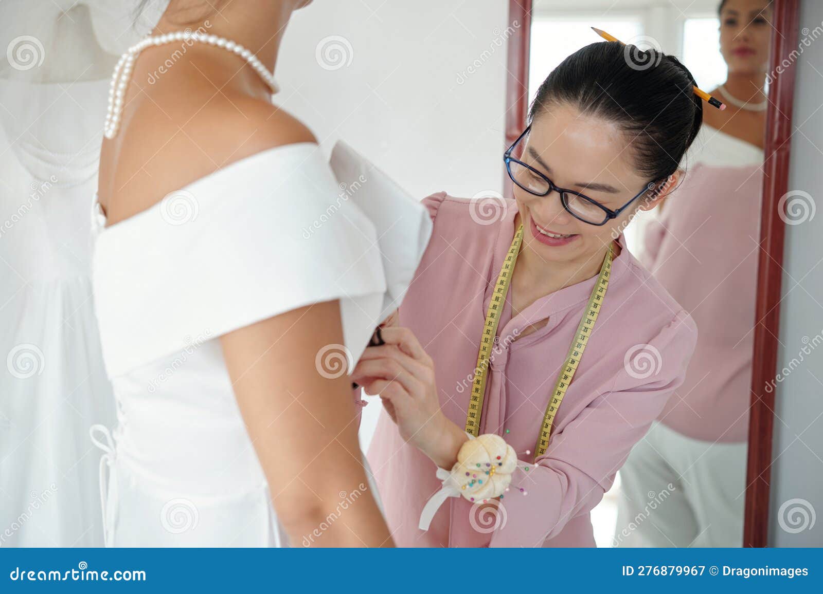 Wedding Dress Fitting stock image. Image of occupation - 276879967
