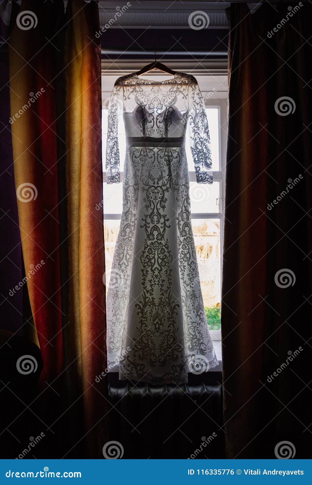 Wedding Dress Hanging on the Window in the Room Stock Photo - Image of ...