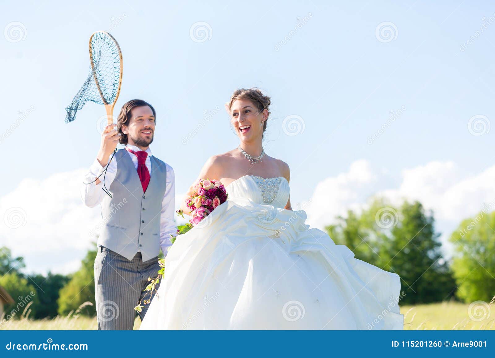 Wedding Groom Catching Bride with Net Stock Photo - Image of roses ...