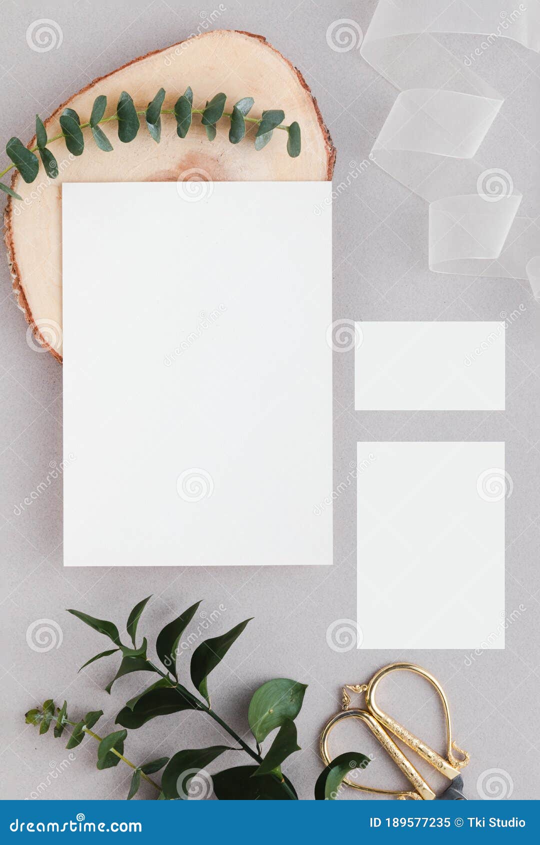 White Wedding Invitation Mockup Under a Wooden Log Piece Surround of ...