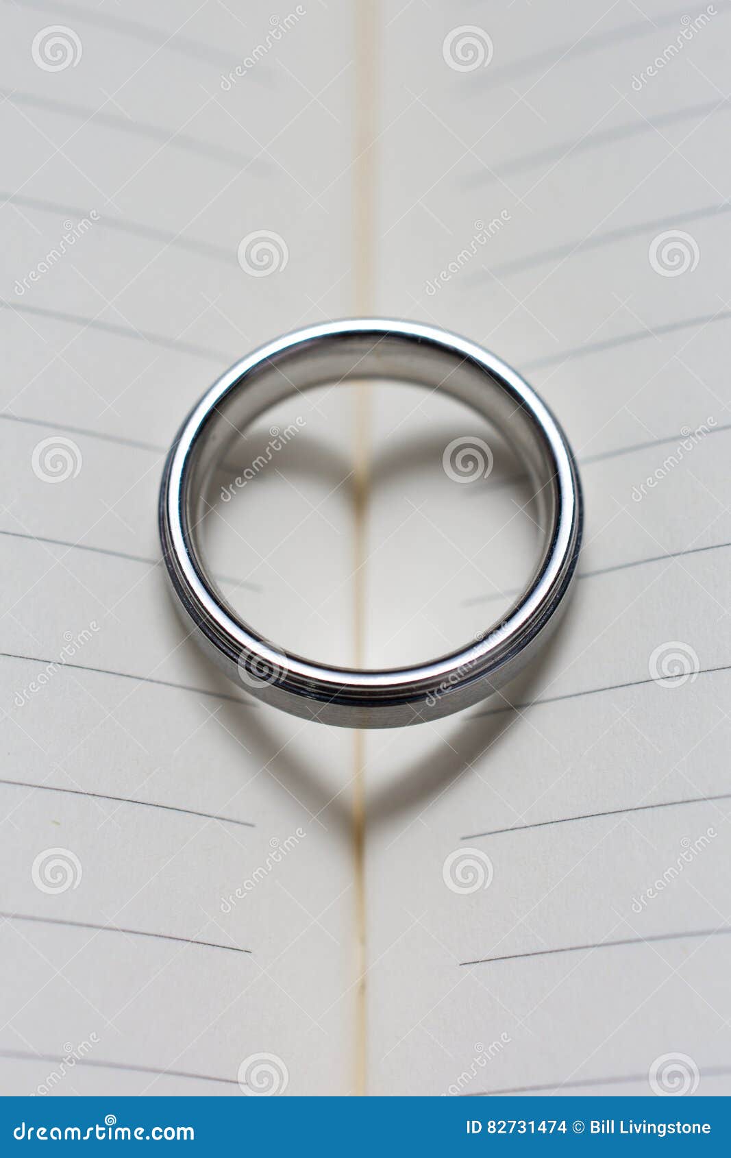 Wedding Ring Band on Book with Heart Shadow Close Up Top View Stock ...