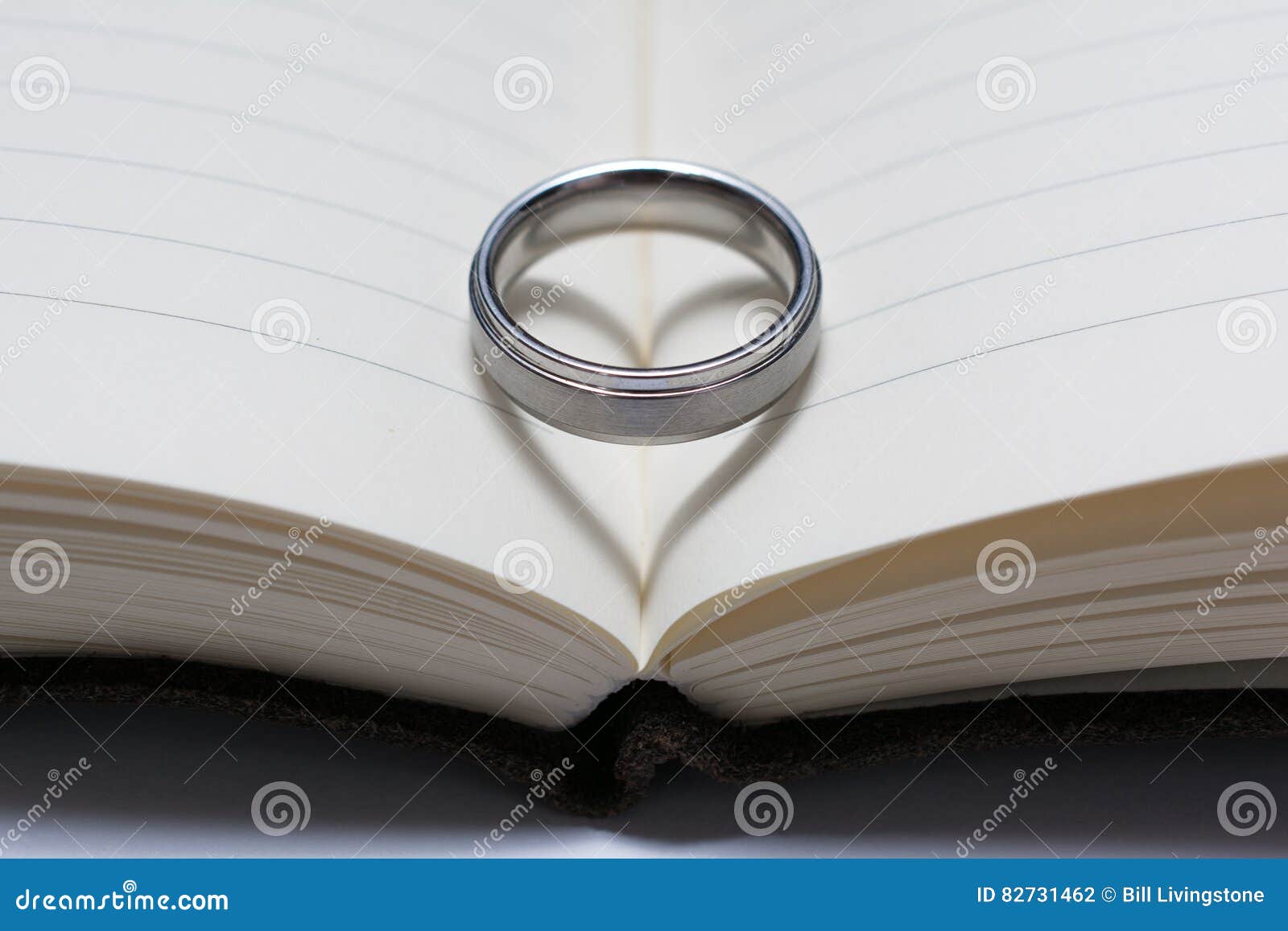 Wedding Ring Band on Book Spine with Heart Shadow Stock Photo - Image ...